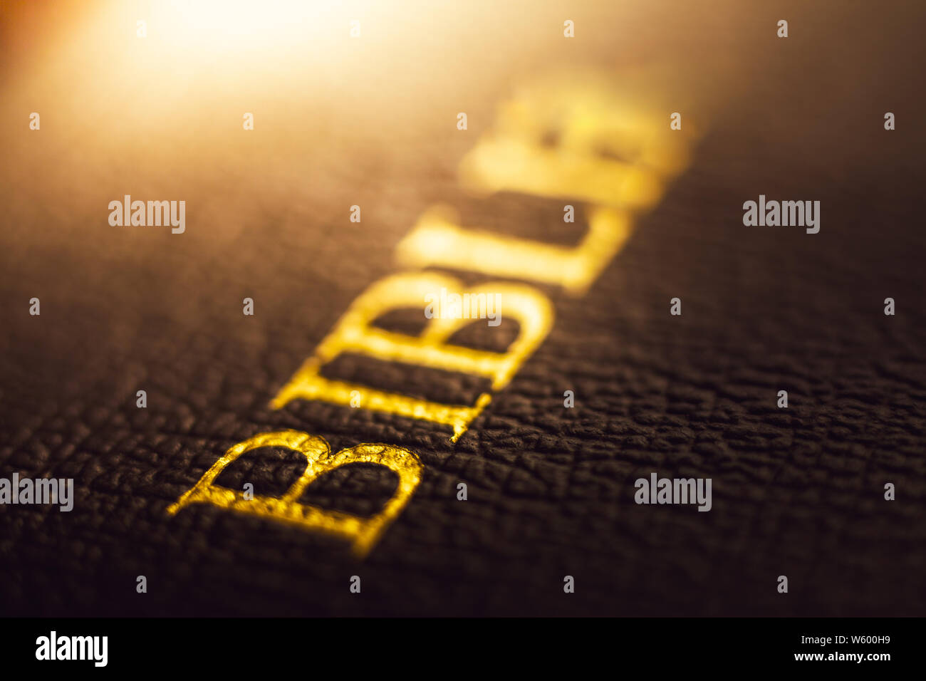 Black Bible cover with golden text Stock Photo - Alamy