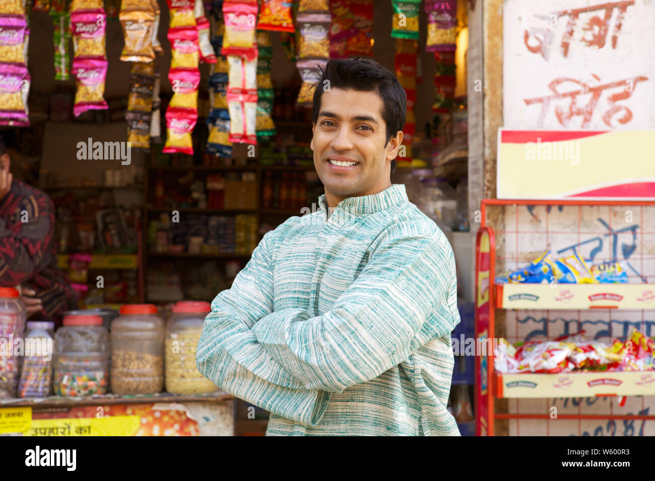 Indian shopkeeper smiling hi-res stock photography and images - Alamy