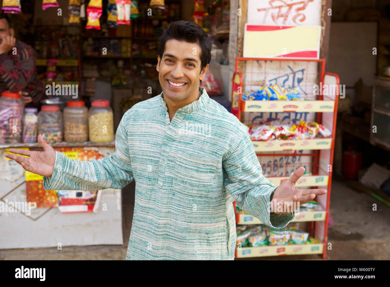 Portrait of a shopkeeper smiling Stock Photo - Alamy