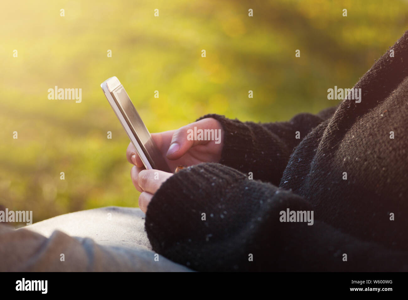 Using mobile phone outdoors Stock Photo - Alamy