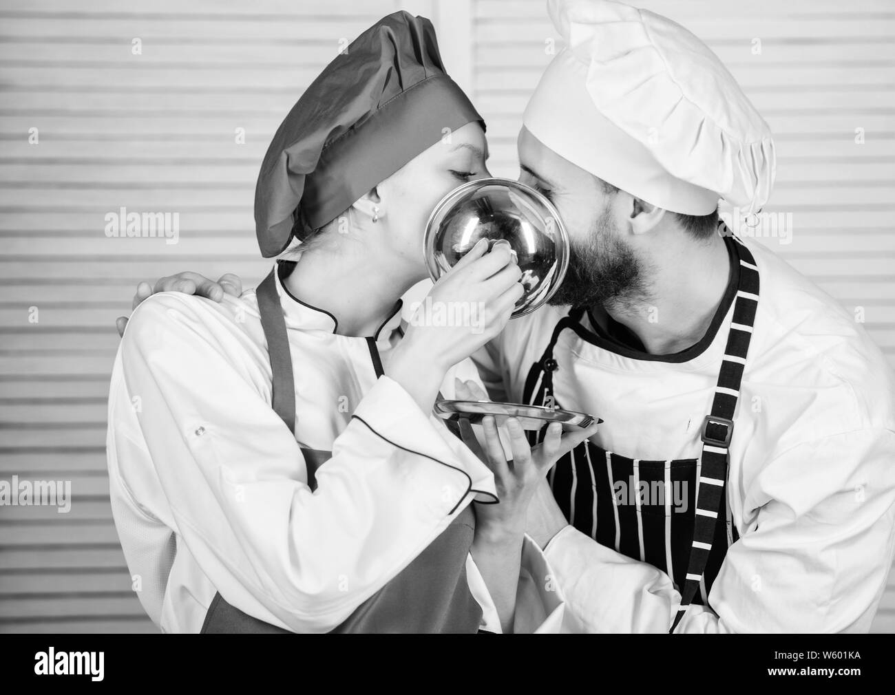 man and woman chef in restaurant behind metallic tray. secret ...