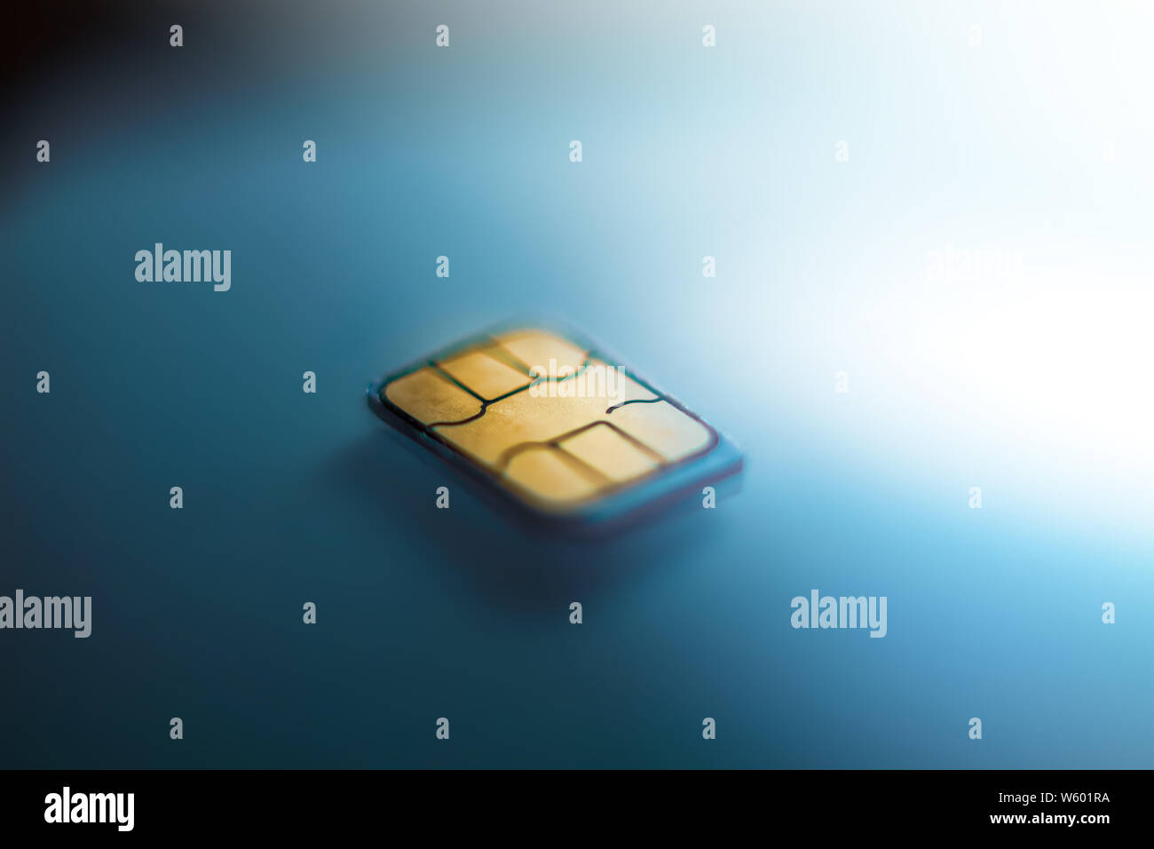 Sim card close up on blured background Stock Photo - Alamy
