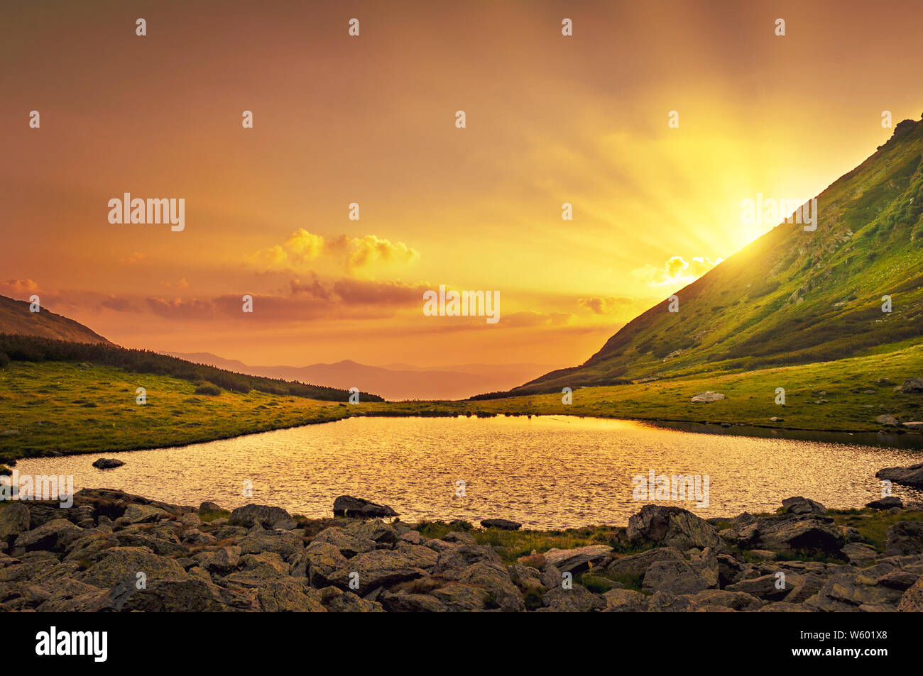 Sunrise over the Iezer lake in Romania Stock Photo - Alamy