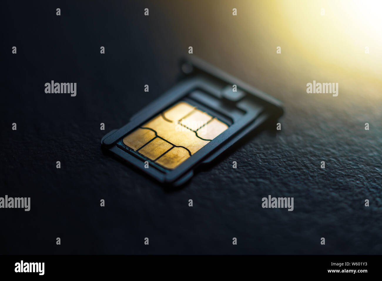 Sim card in tray close up Stock Photo - Alamy