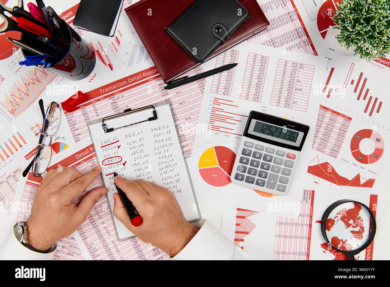 Business reports, data tables and charts - directly above view of ...