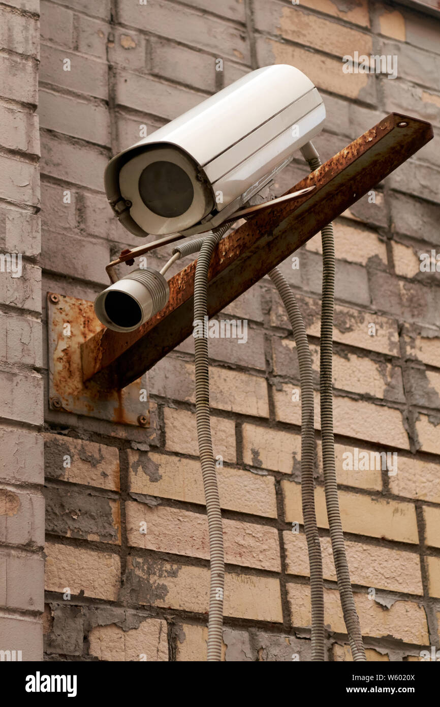 outdoor video cameras on a brick wall background Stock Photo - Alamy