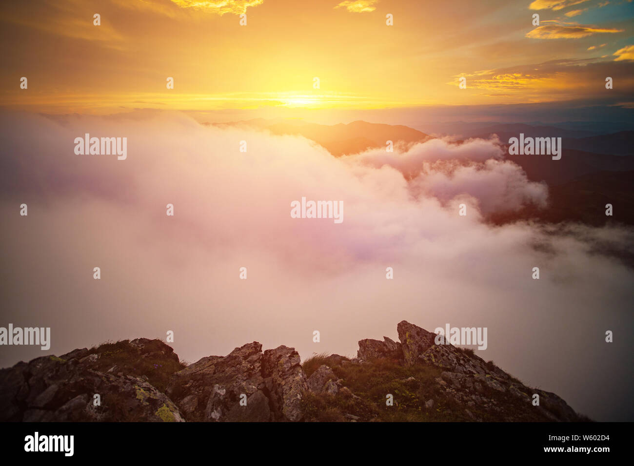 Above the clouds mountain sunset landscape in Romania Stock Photo - Alamy