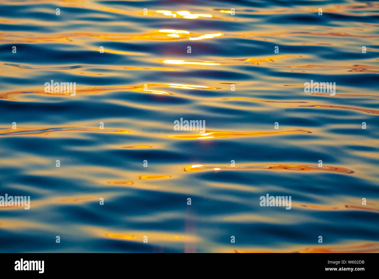 Lake water texture at sunset beautiful background Stock Photo - Alamy
