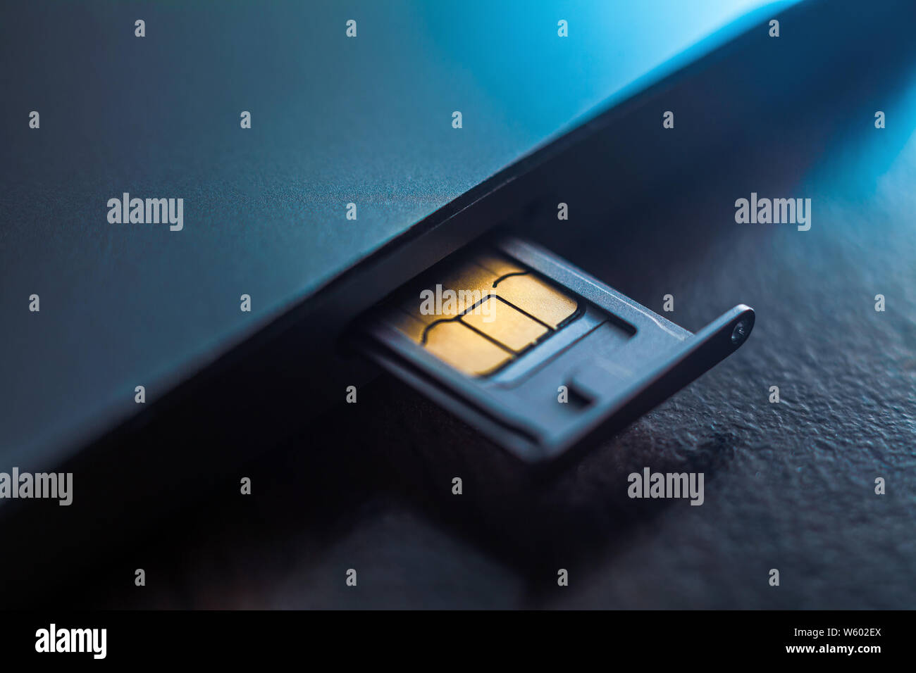 Sim card in tray being inserted into phone Stock Photo - Alamy