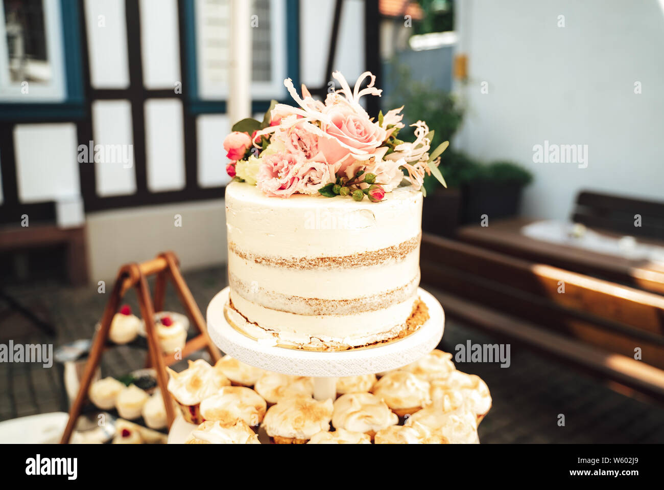 Layered gateau cake on a stand on a buffet Stock Photo - Alamy