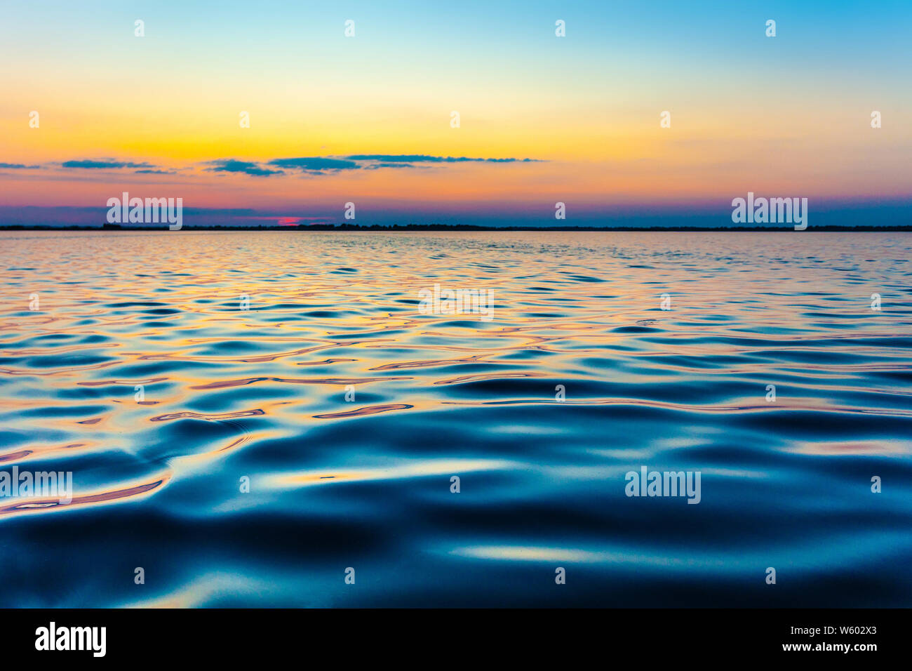 Lake water texture at sunset beautiful background Stock Photo - Alamy