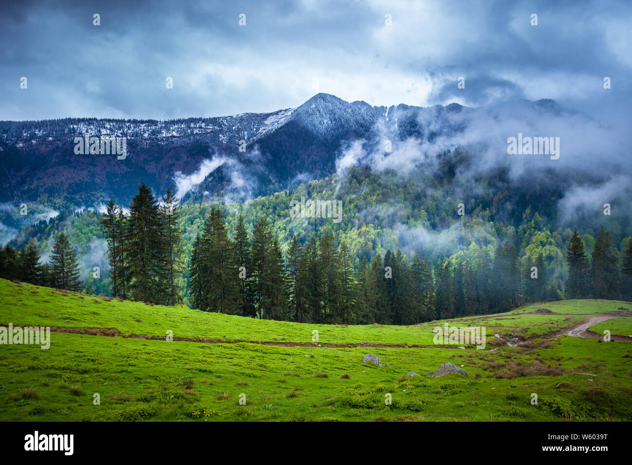 Mist rises, beautiful, epic and moody mountsain landscape Stock Photo ...