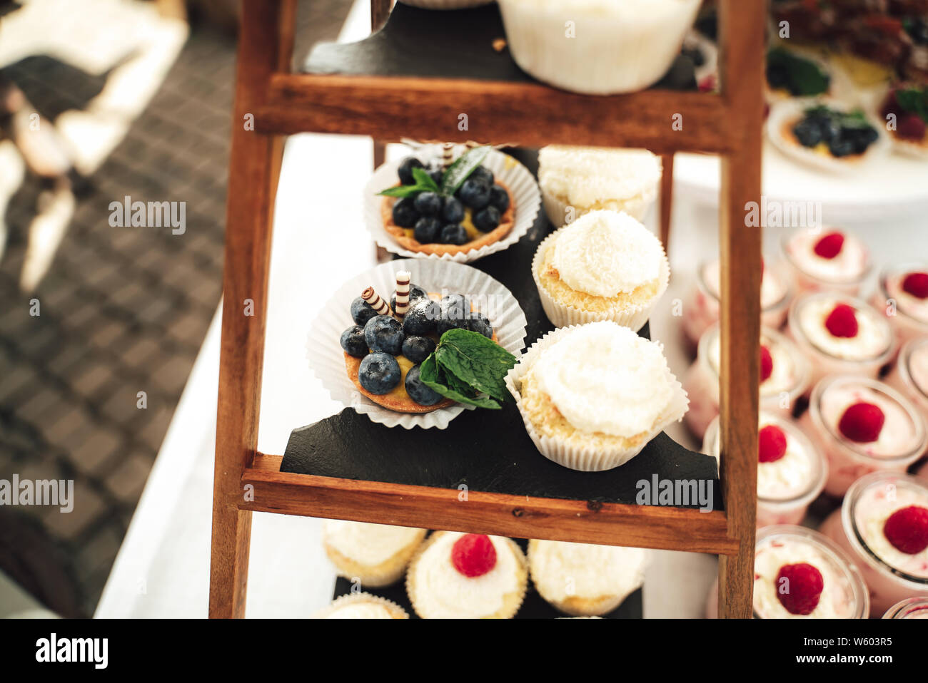 Cream muffins and fruity pastries on a buffet Stock Photo - Alamy