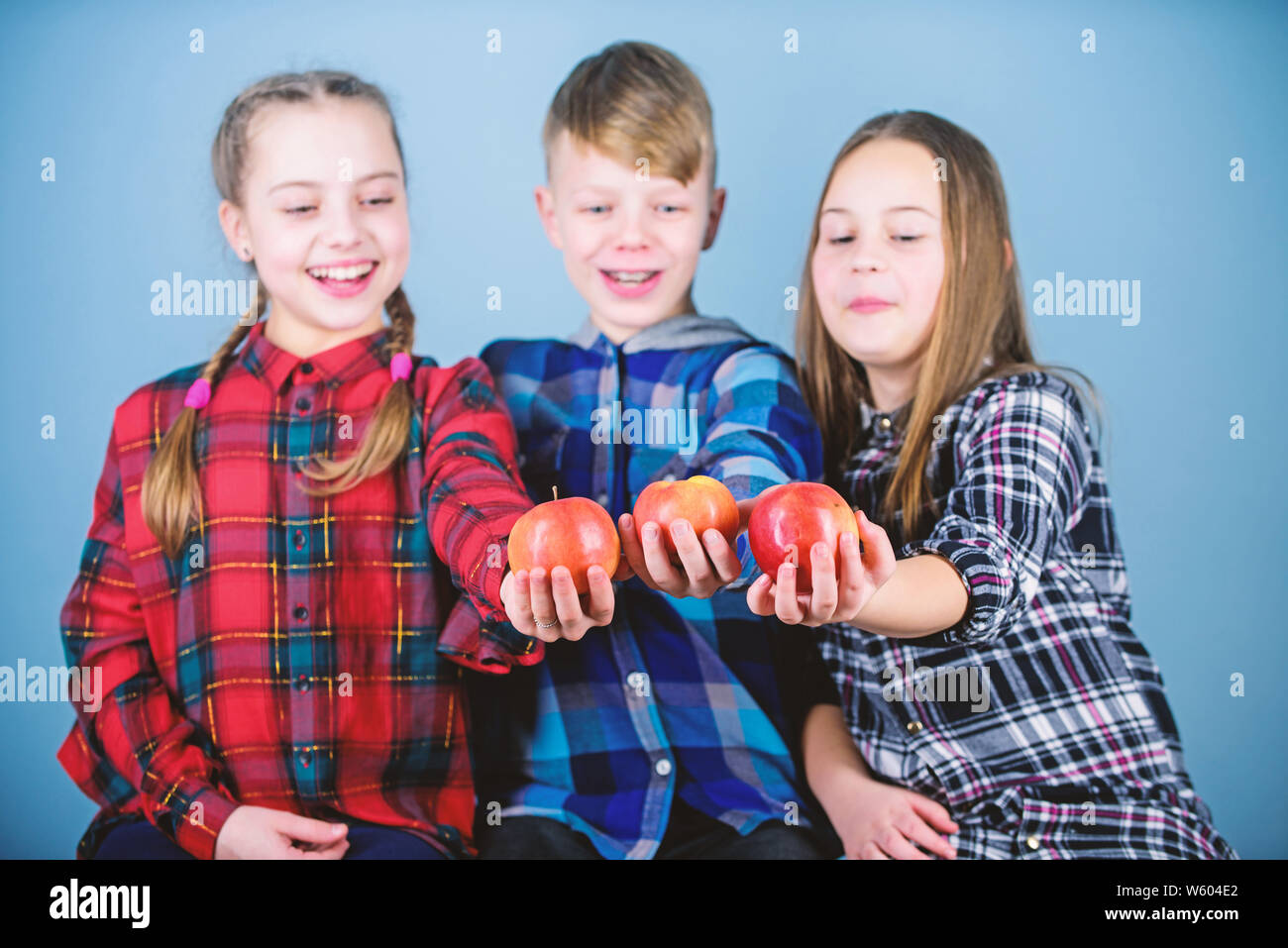 Giving children a healthy diet. Little children choosing organic diet ...