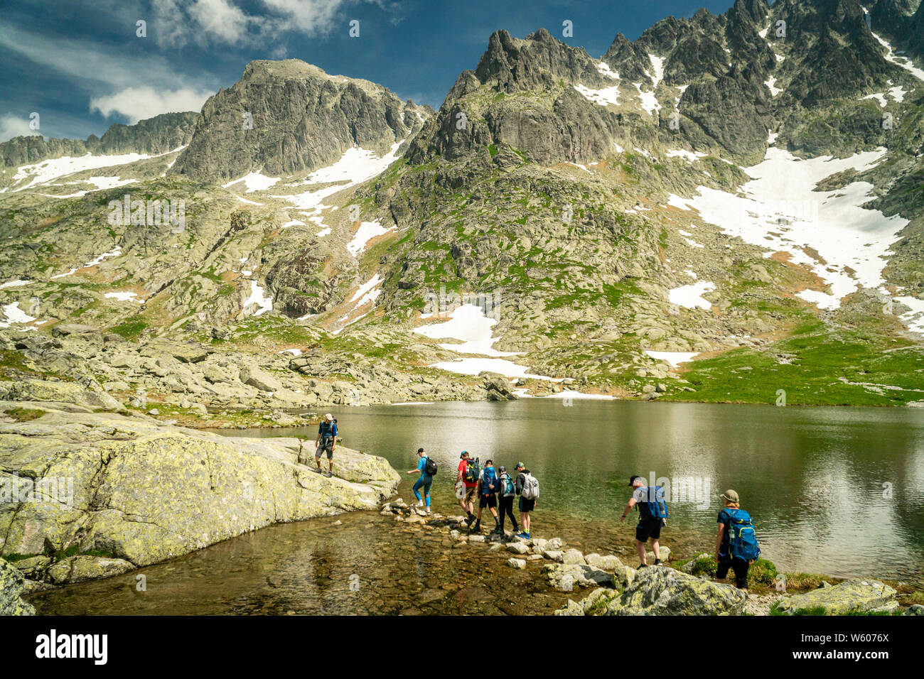 Hikers enjoying trekking crossing mountain hi-res stock photography and ...