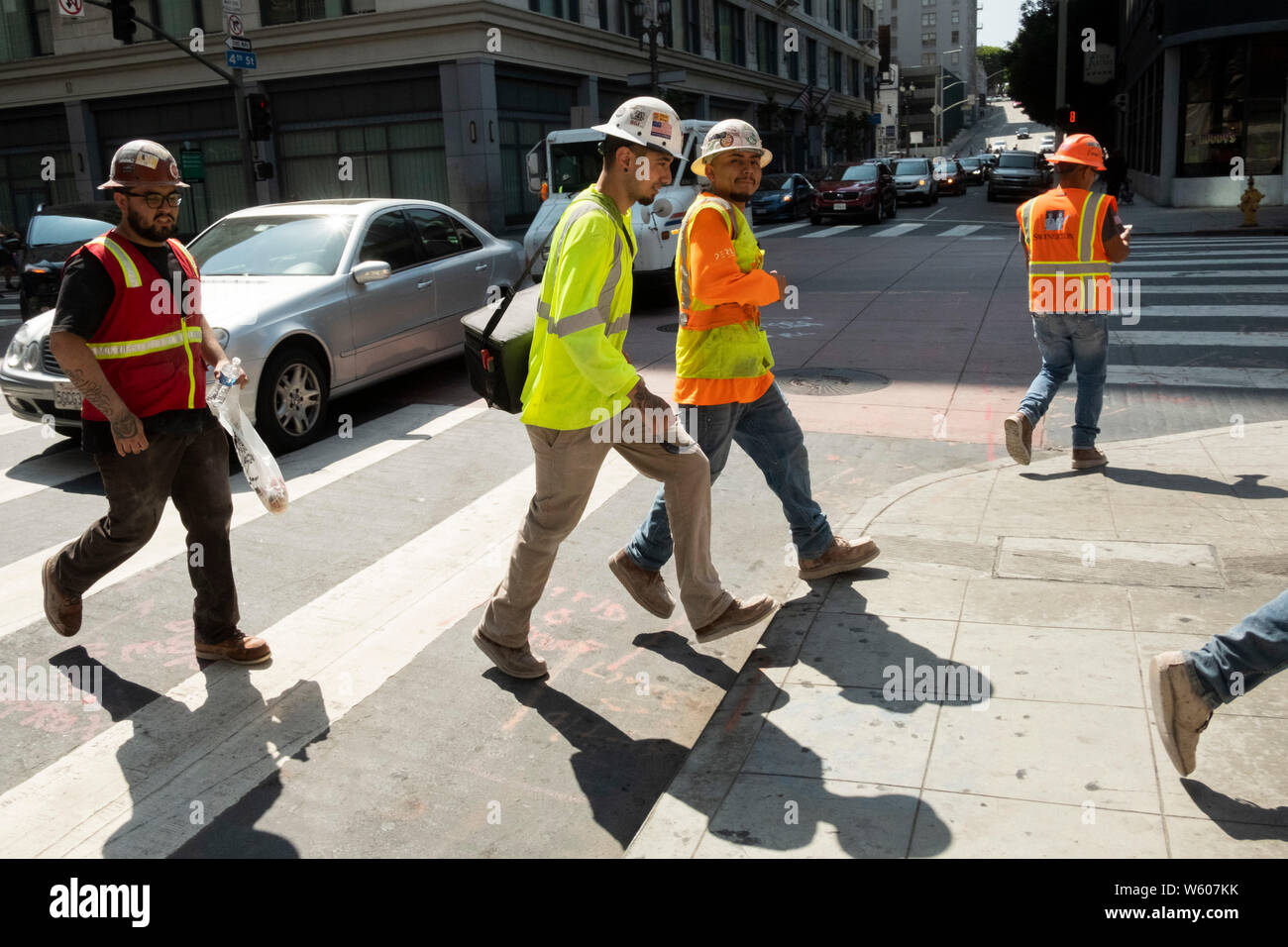 Construction workers leaving the job site. Downtown Los Angeles ...