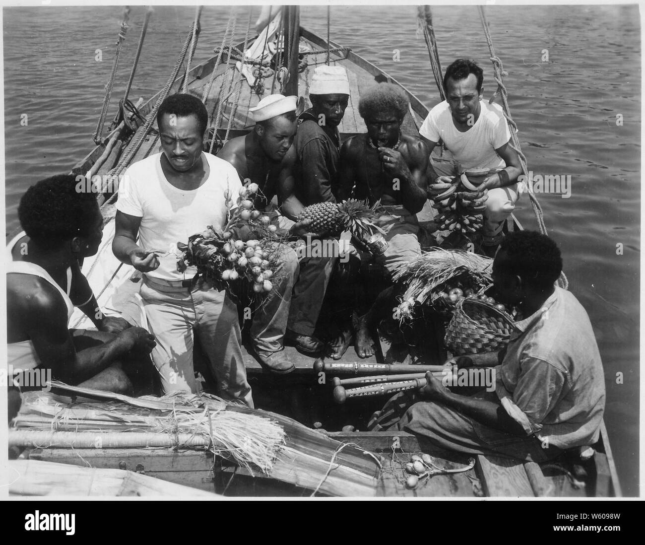 34th cbs trading with natives from malaita left to right Black and ...