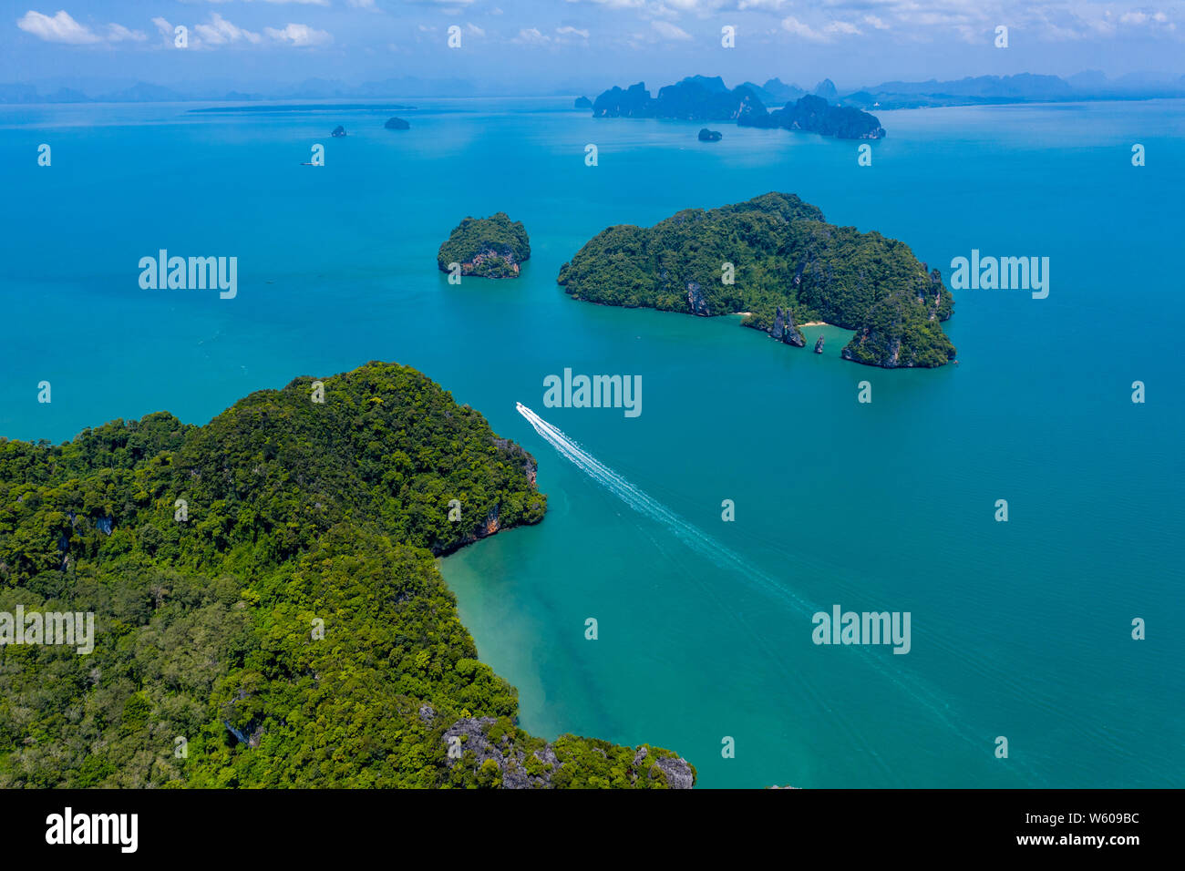 Aerial drone view of beautiful lush green tropical islands with remote ...