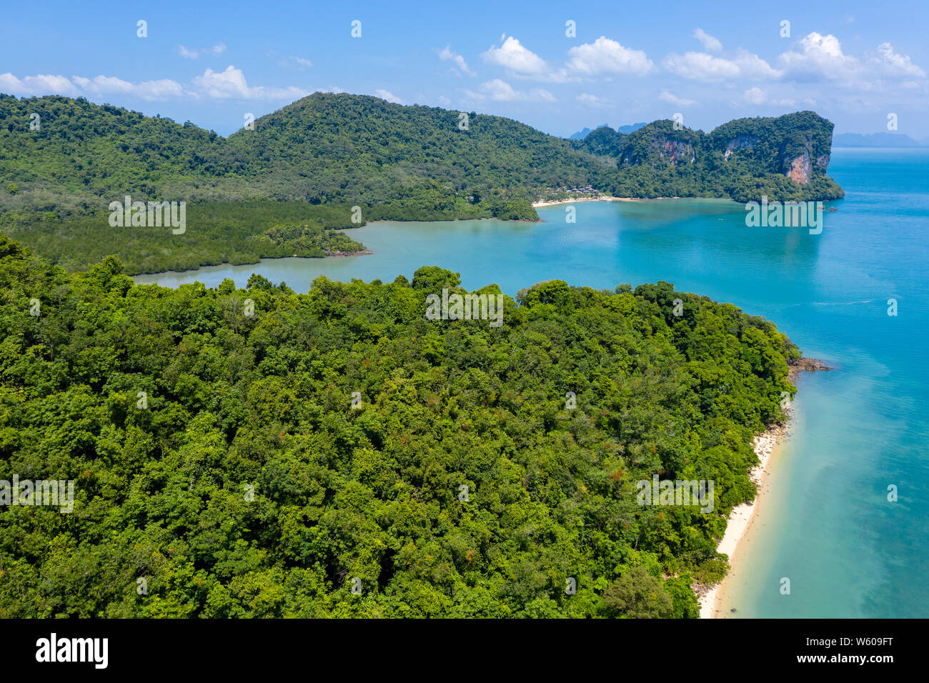 Aerial drone view of beautiful lush green tropical islands with remote ...