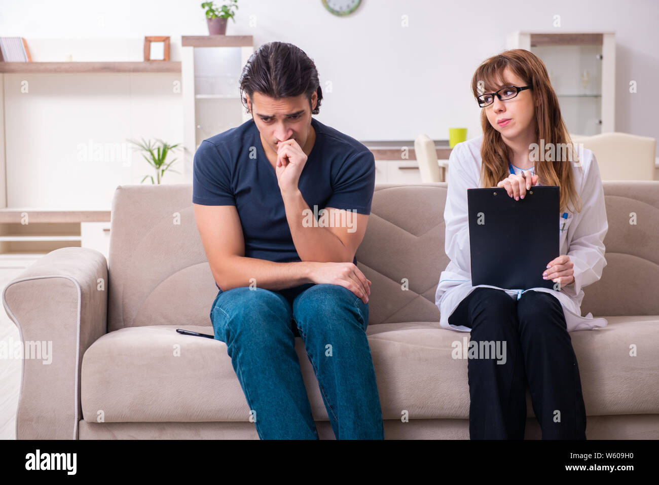 The young male patient discussing with female psychologist personal ...