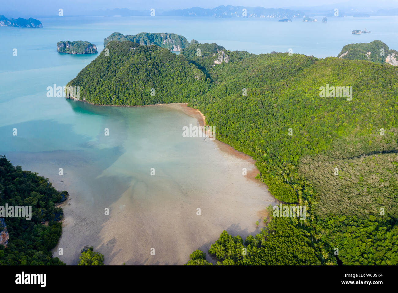 Aerial drone view of beautiful lush green tropical islands with remote ...