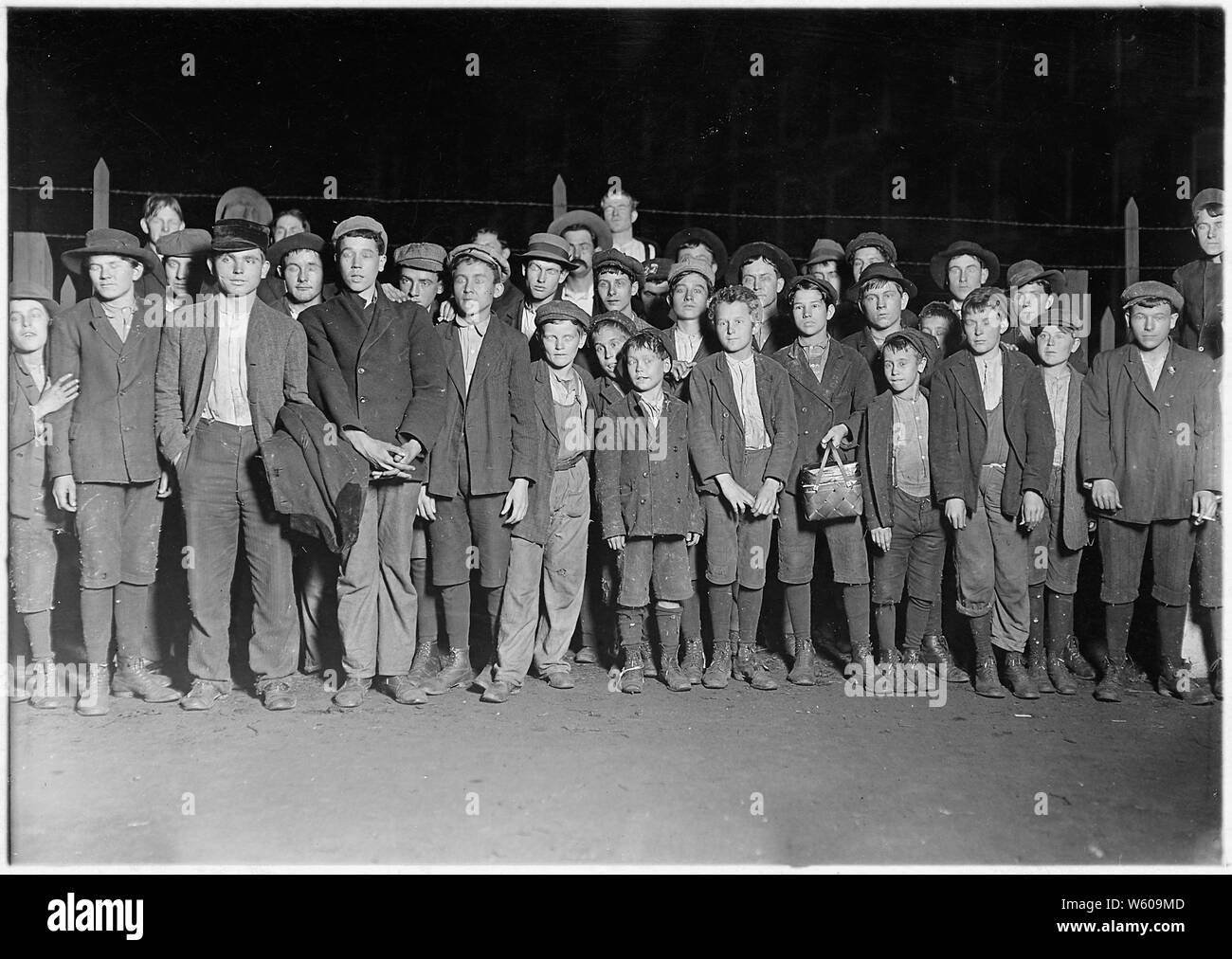 6 P.M. Flashlight photo of part of force going home. Silby Mfg. Co ...