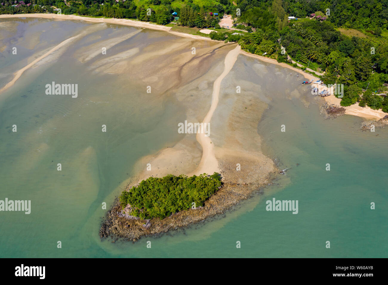 Aerial view of a small offshore island connected by a small, winding ...