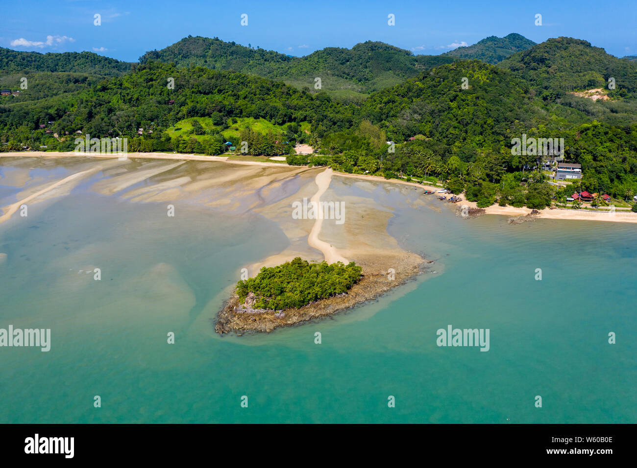 Aerial view of a small offshore island connected by a small, winding ...