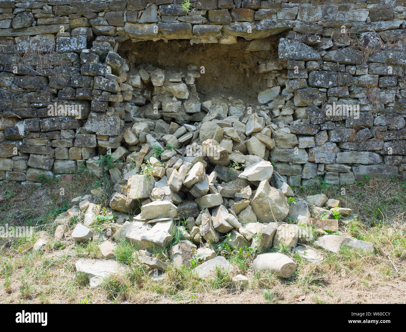 dry stone wall collapsed due to the earthquake requires restoration ...