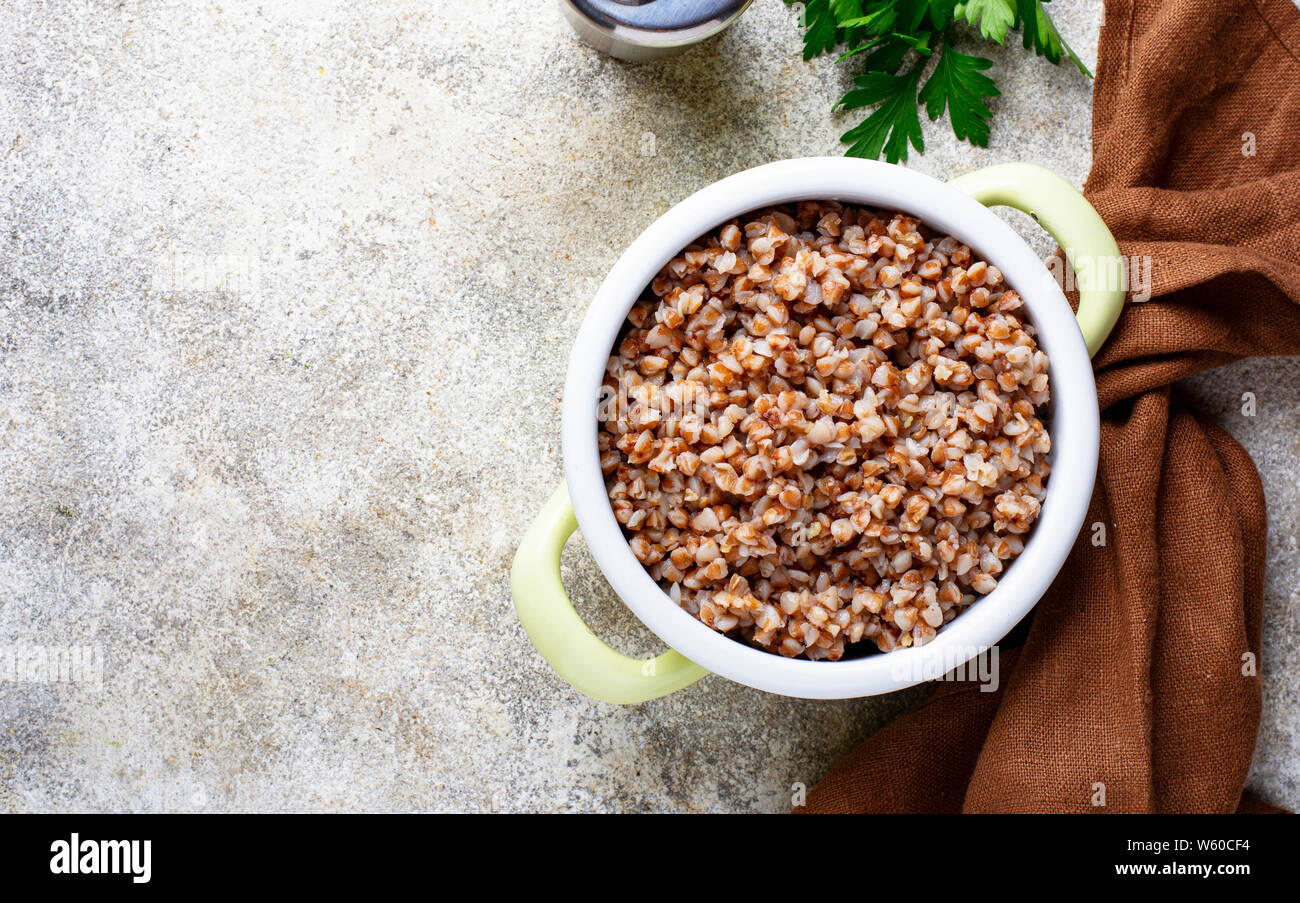 Buckwheat porridge in green pot Stock Photo - Alamy