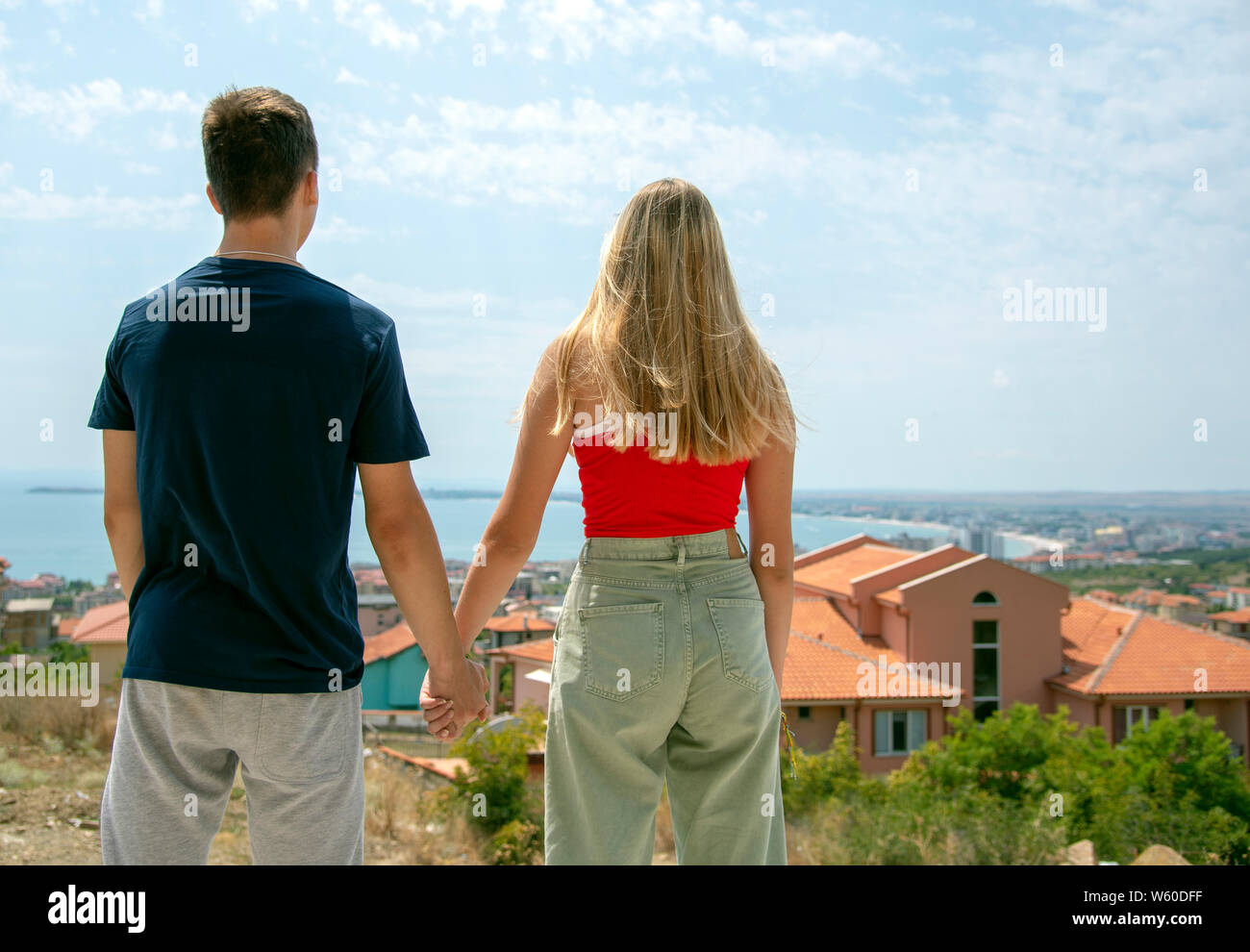 Two Teenagers Holding Hands
