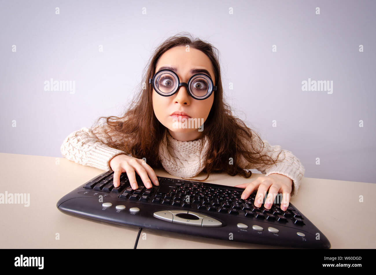 The funny nerd girl working on computer Stock Photo - Alamy