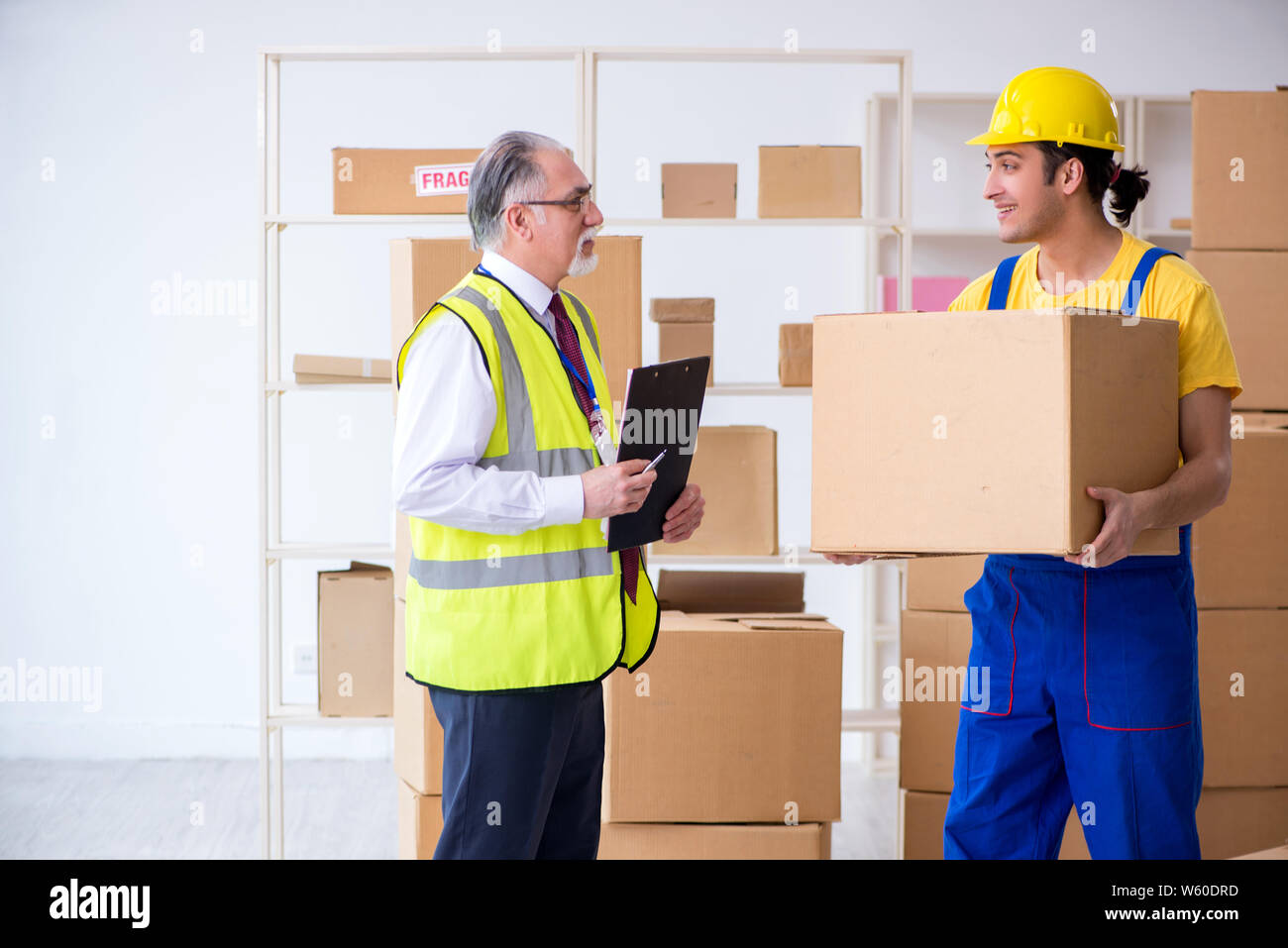The professional movers doing home relocation Stock Photo - Alamy