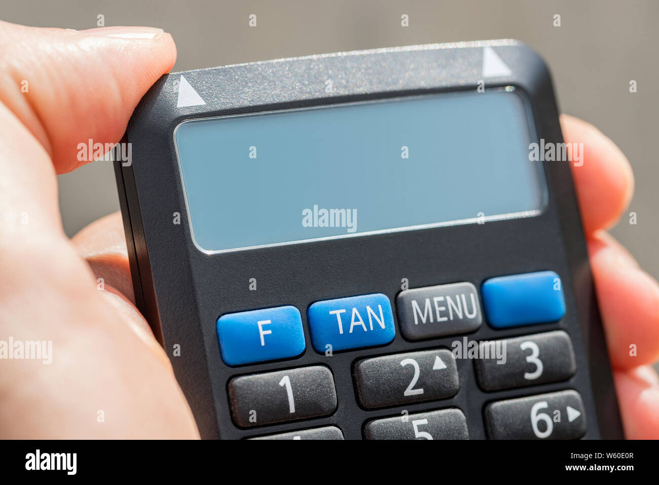 tan generator in human hand Stock Photo - Alamy