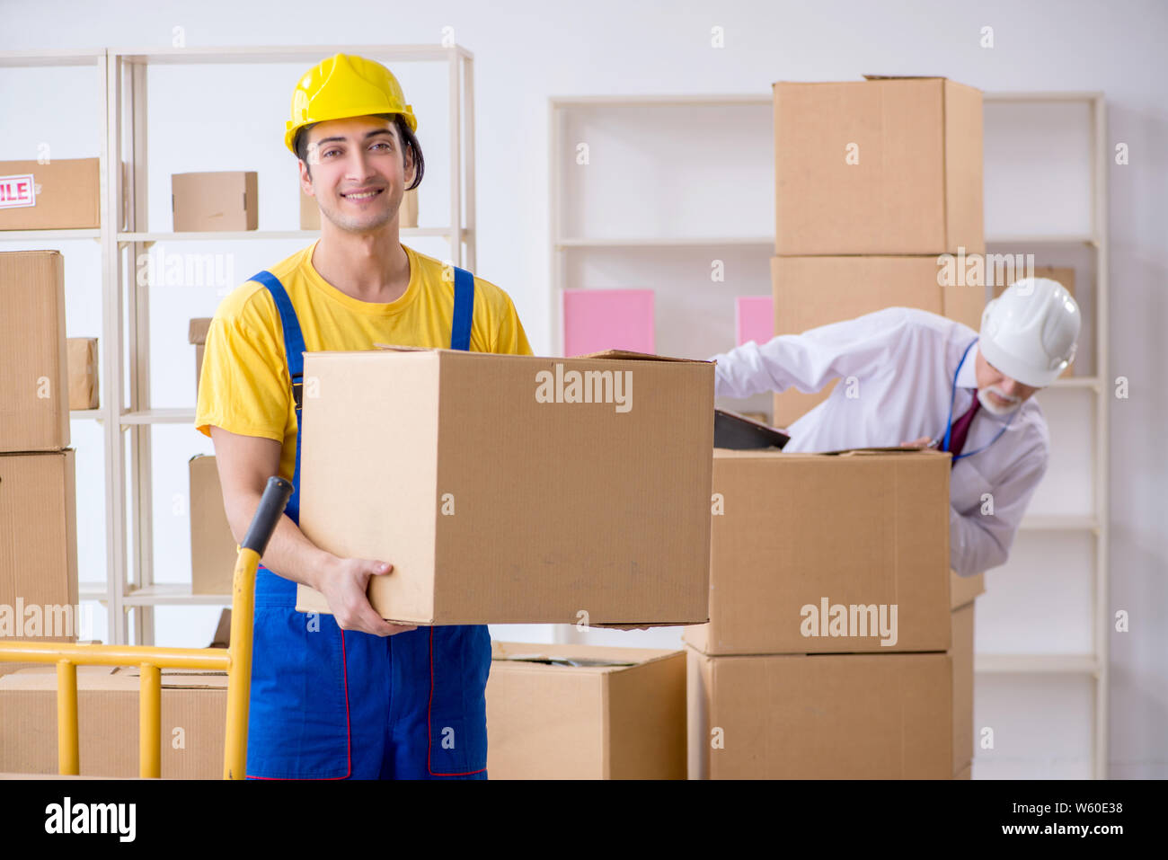 The professional movers doing home relocation Stock Photo - Alamy