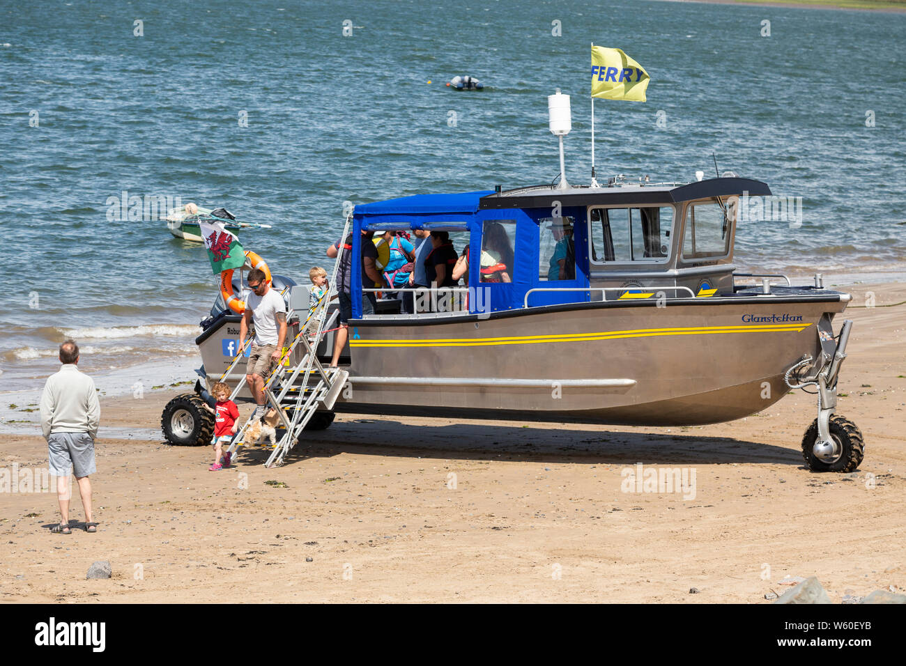 Passengers disembark at Ferryside from Glansteffan, the amphibious ...