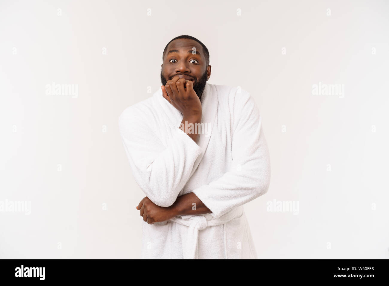 Portrait of excited young African American male screaming in shock and ...