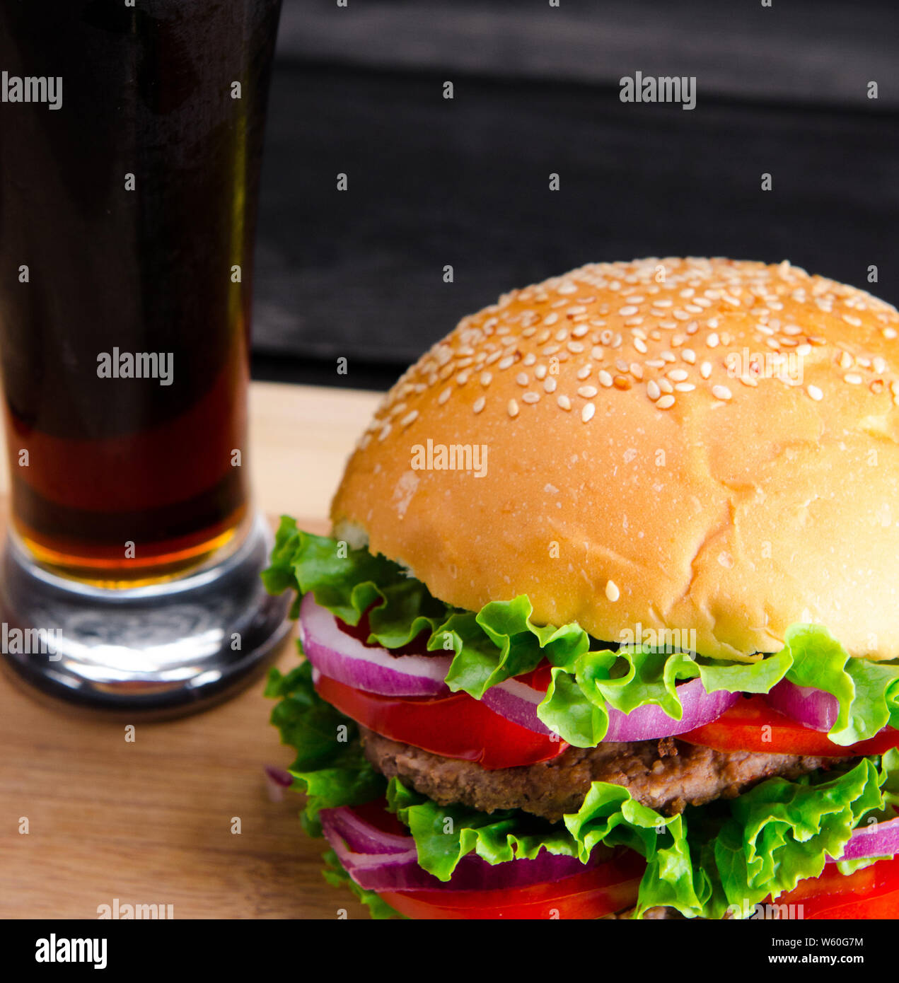 The burger served in bun in nutrition fast food concept Stock Photo - Alamy