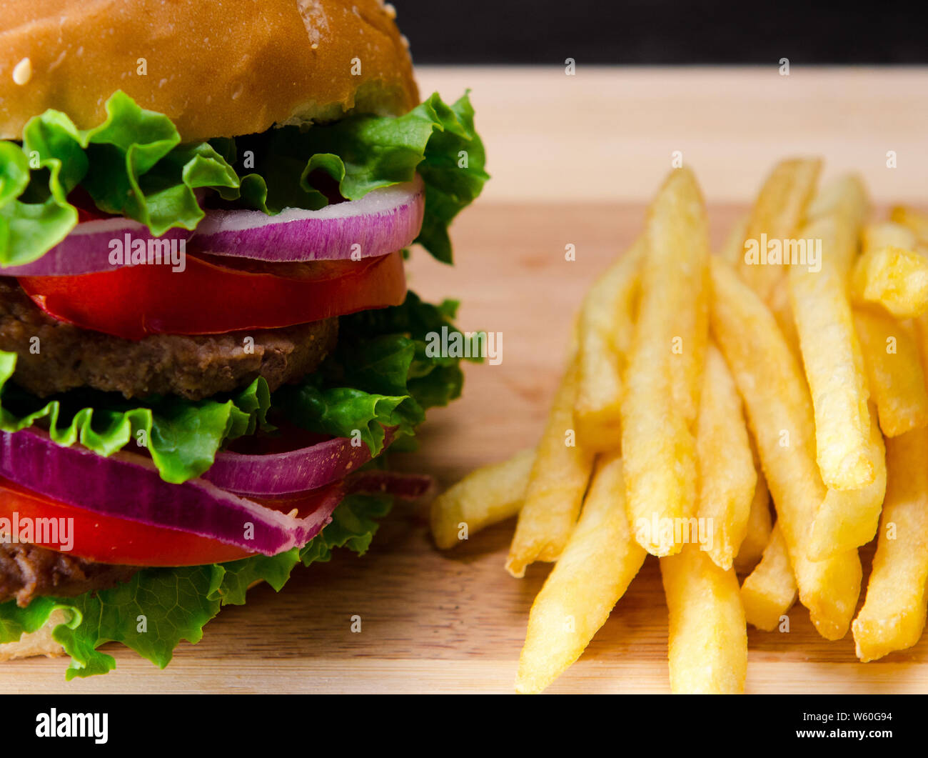 The burger served in bun in nutrition fast food concept Stock Photo - Alamy
