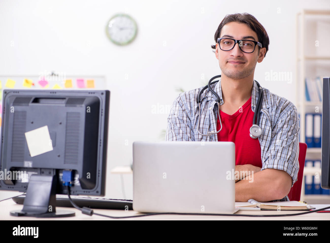 The male it specialist working in the office Stock Photo - Alamy