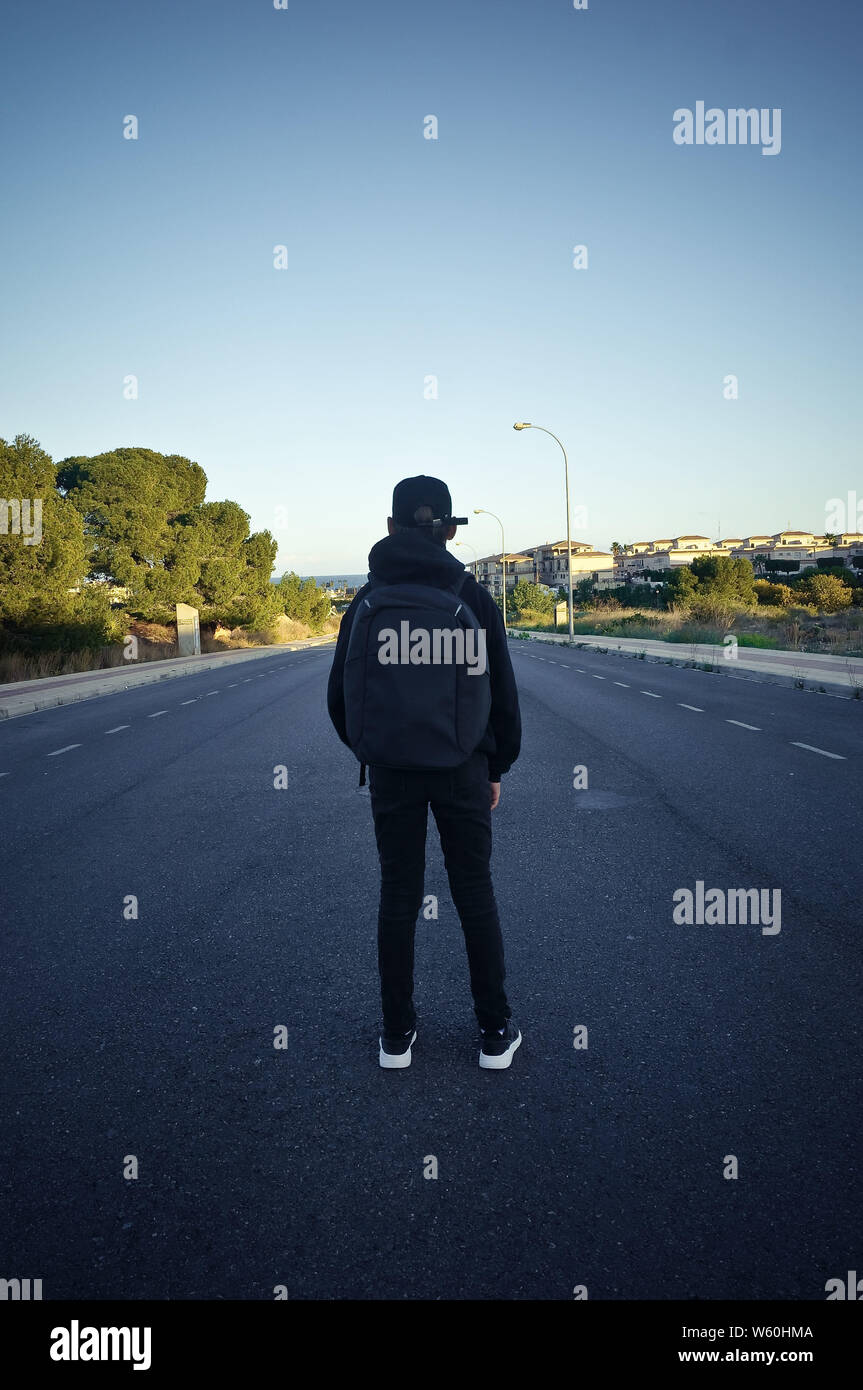 Teenage male backpack behind hi-res stock photography and images - Alamy