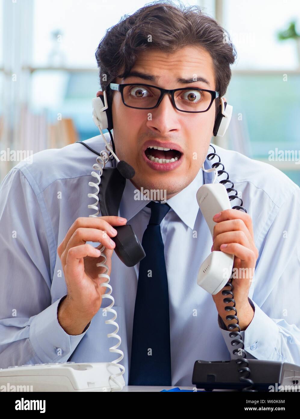 The unhappy angry call center worker frustrated with workload Stock ...