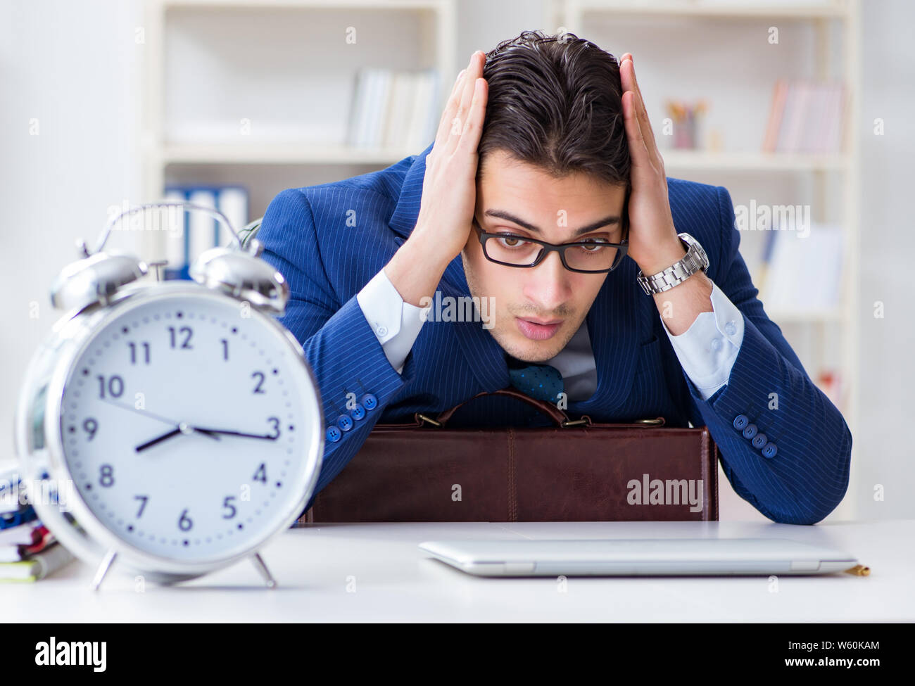 The businessman in bad time management concept Stock Photo - Alamy