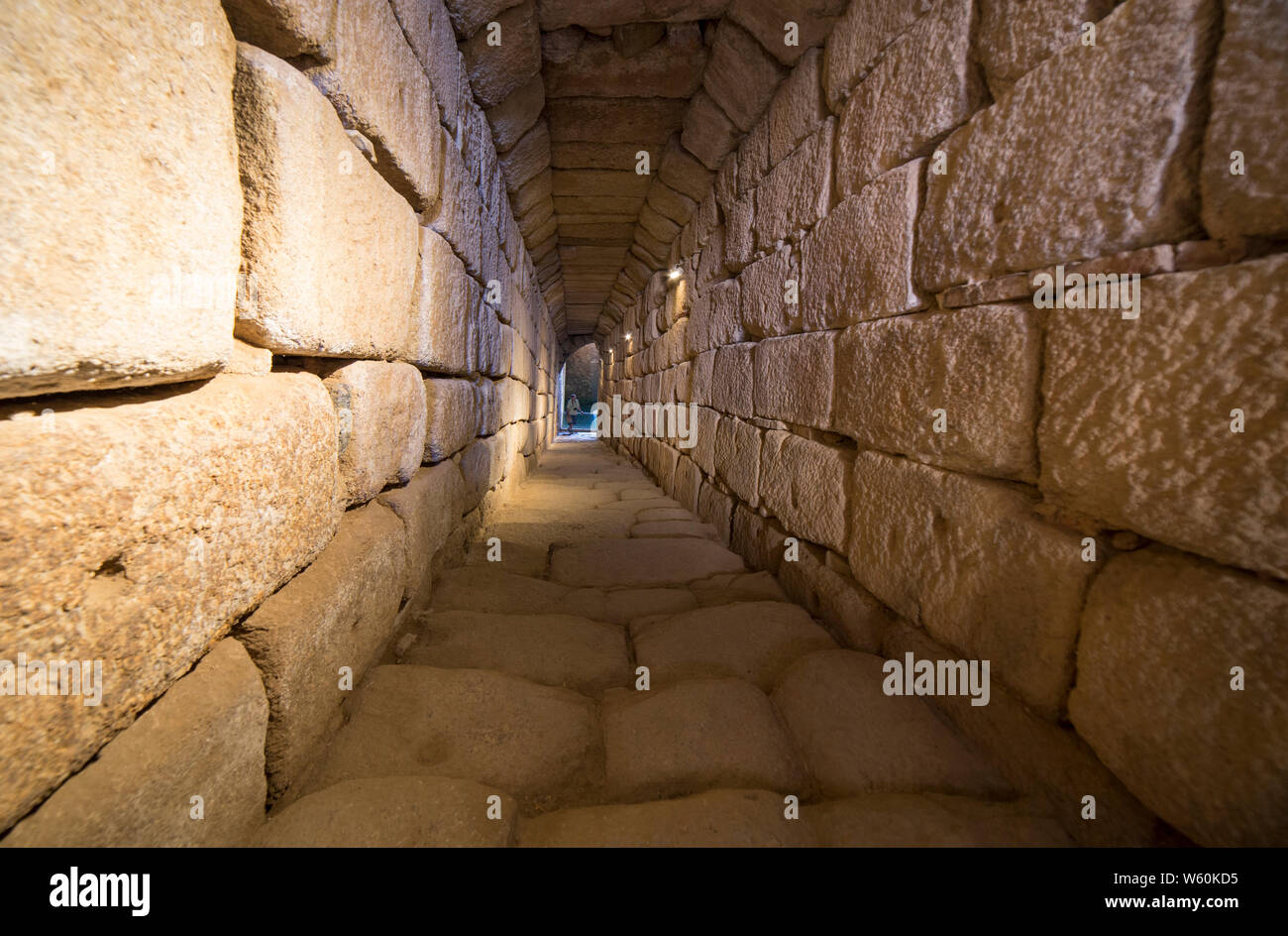 South corridor of roman water cistern with visitors at Alcazaba arab ...