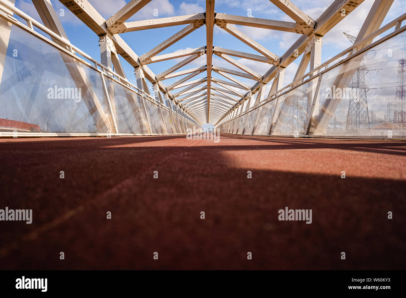 Pedestrian bridge with modern geometric shapes in futuristic style ...