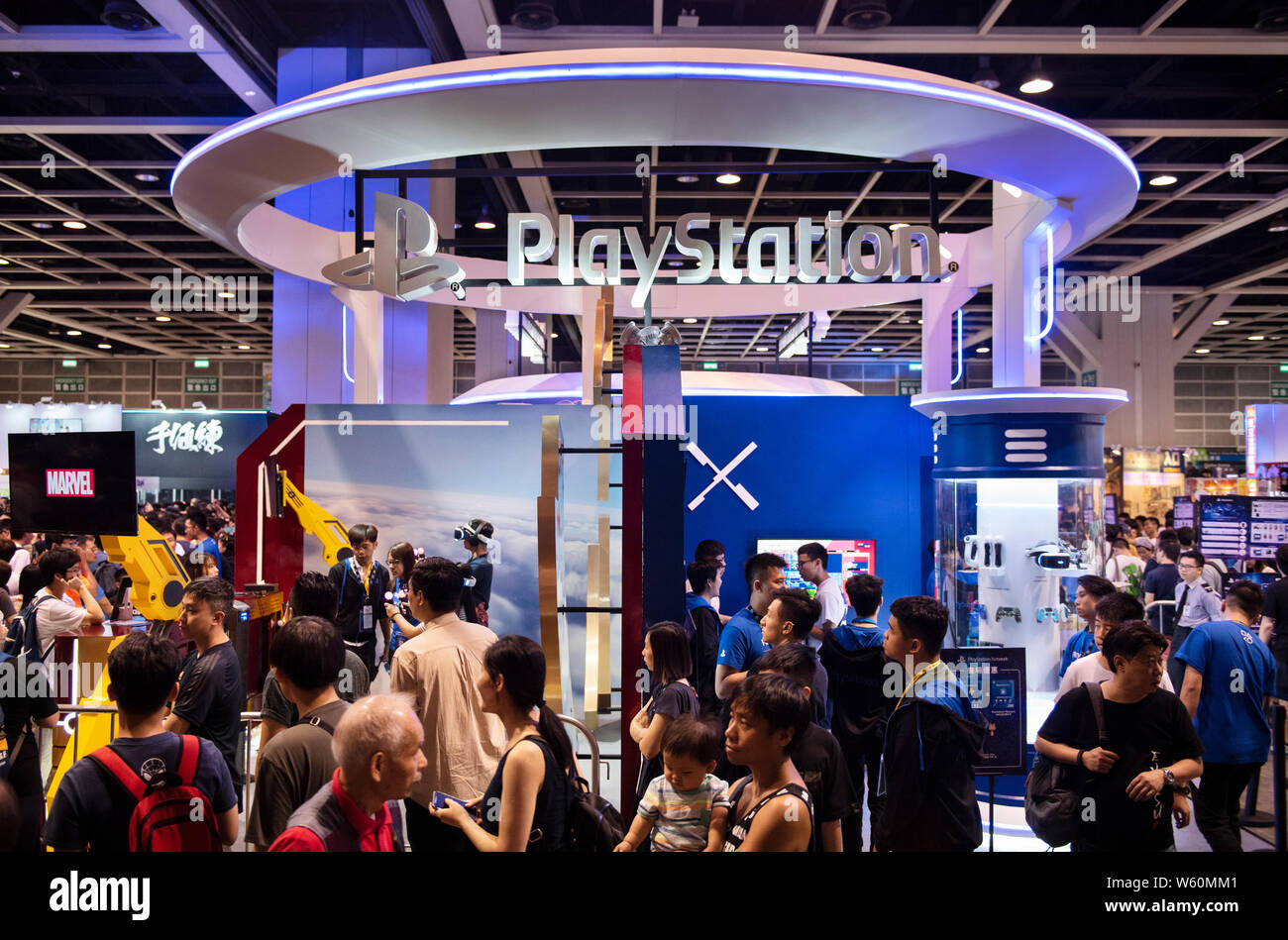 Visitors are seen at Sony' PlayStation brand booth during the Ani-Com ...