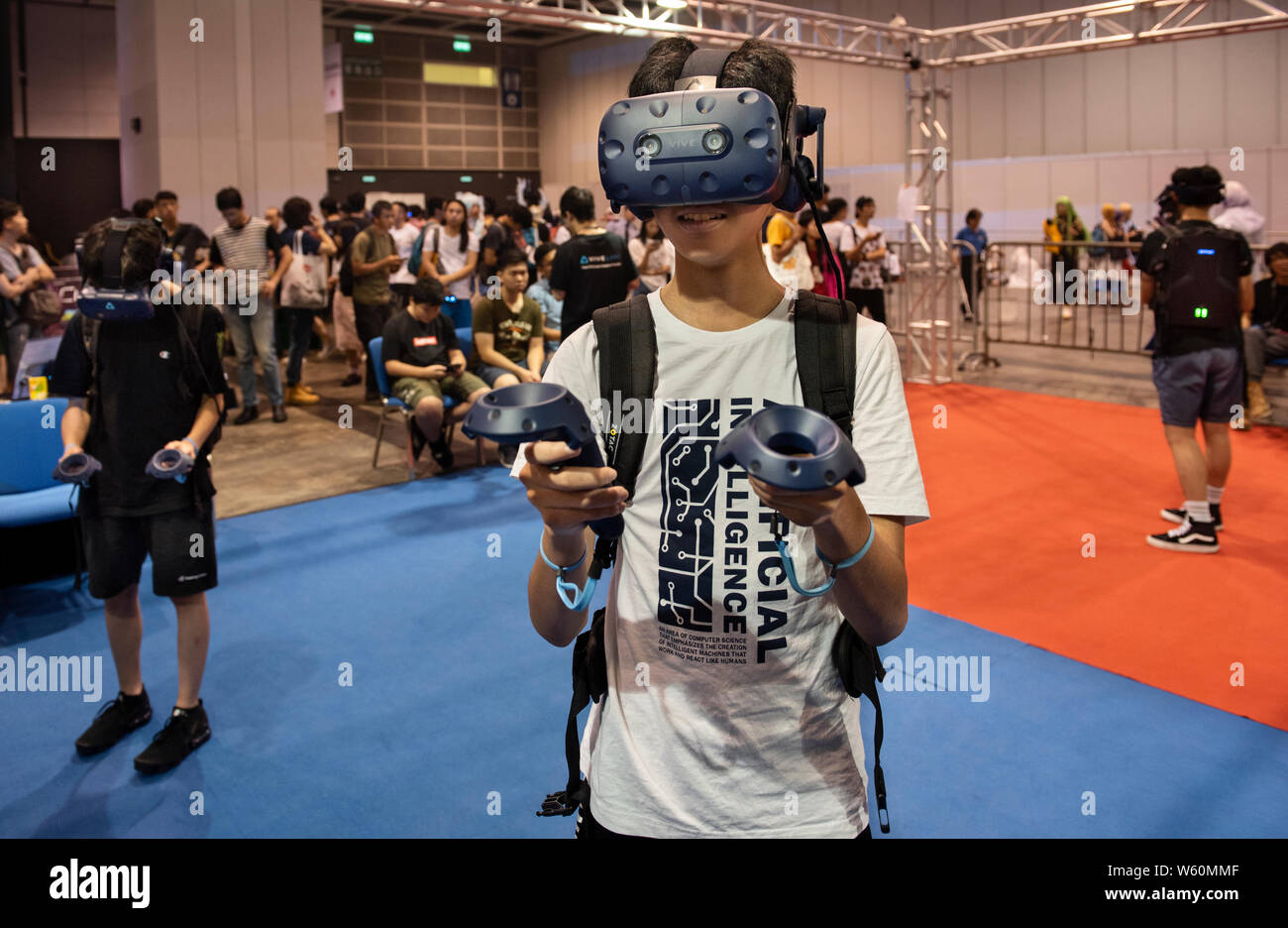 Visitors play with a Virtual Reality VR set during the E-Sports and ...
