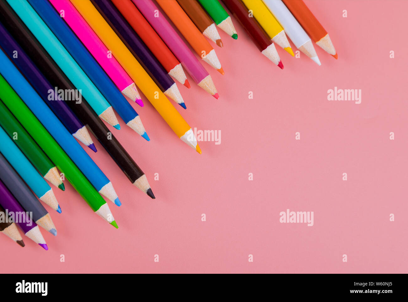 Color pencils on pink background for art class and back to school Stock ...