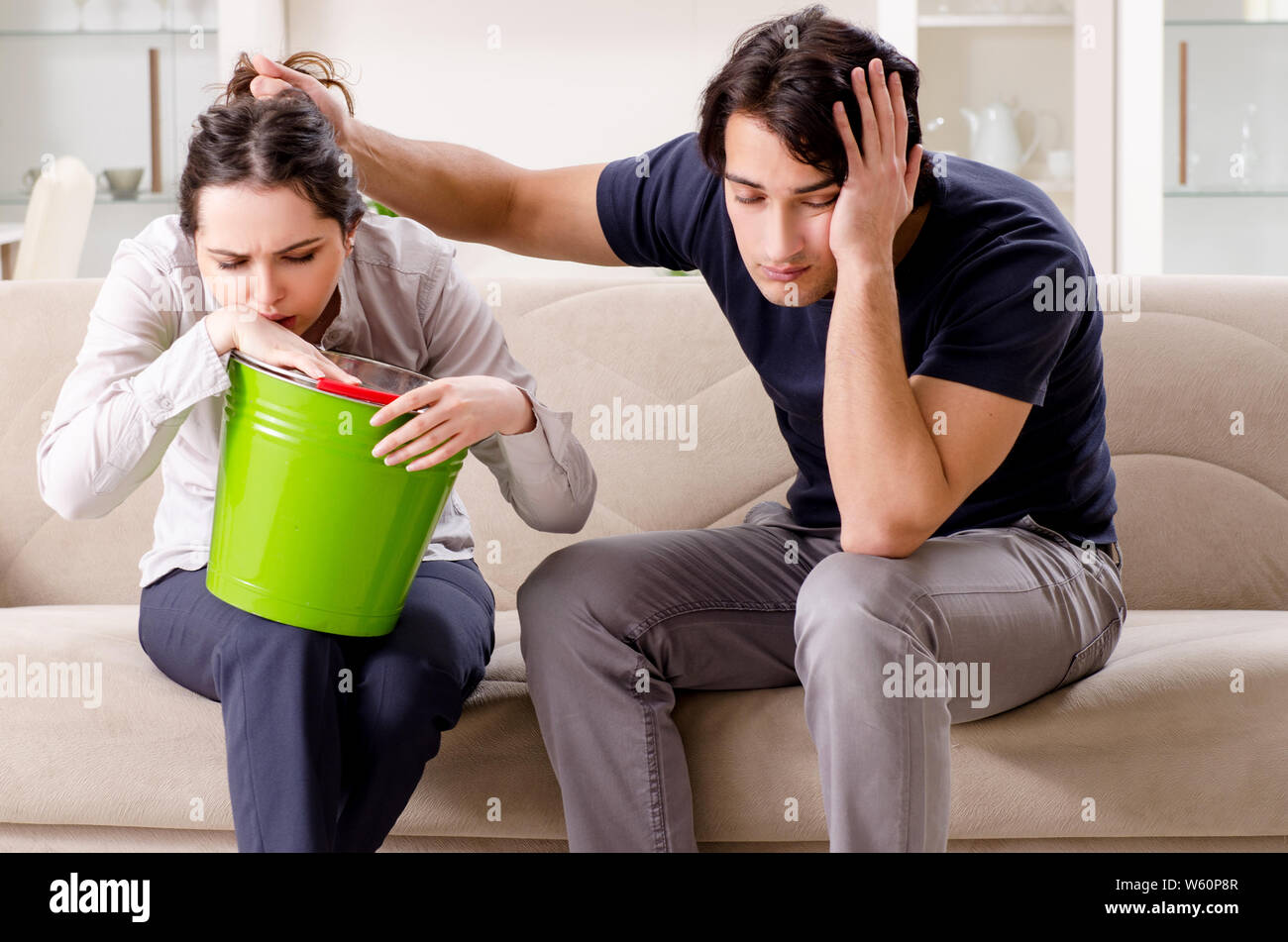 The young wife suffering from sick stomach and vomiting Stock Photo - Alamy