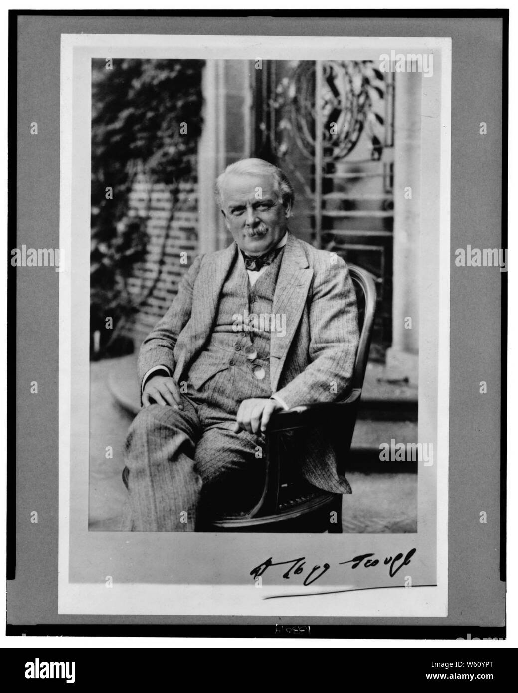 David Lloyd George, three-quarter length portrait, seated, facing front ...